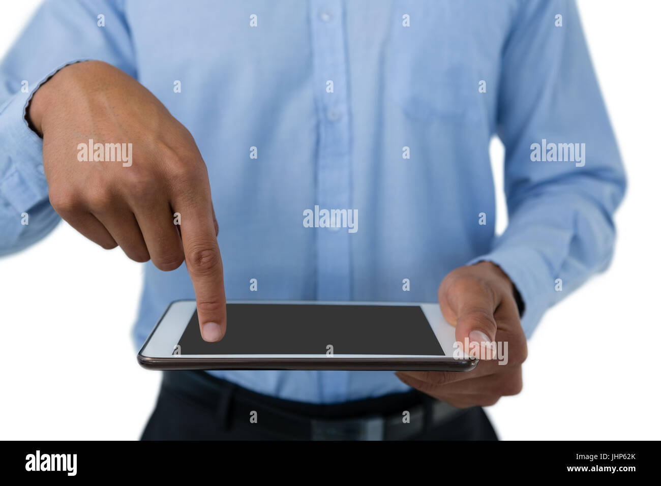 Mid section of businessman pointing on tablet computer while standing ...