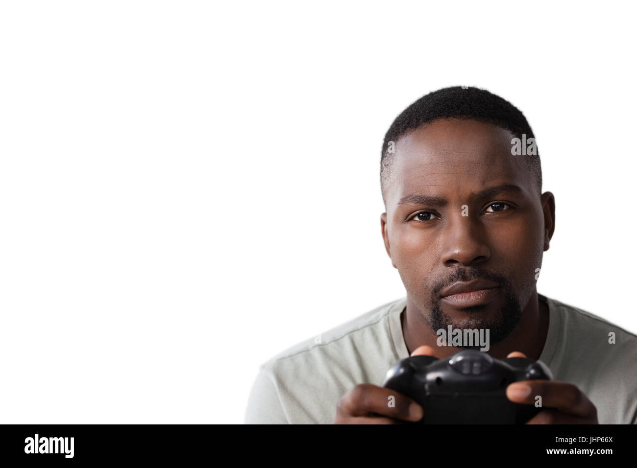 Close-up of man playing video game against white background Stock Photo ...