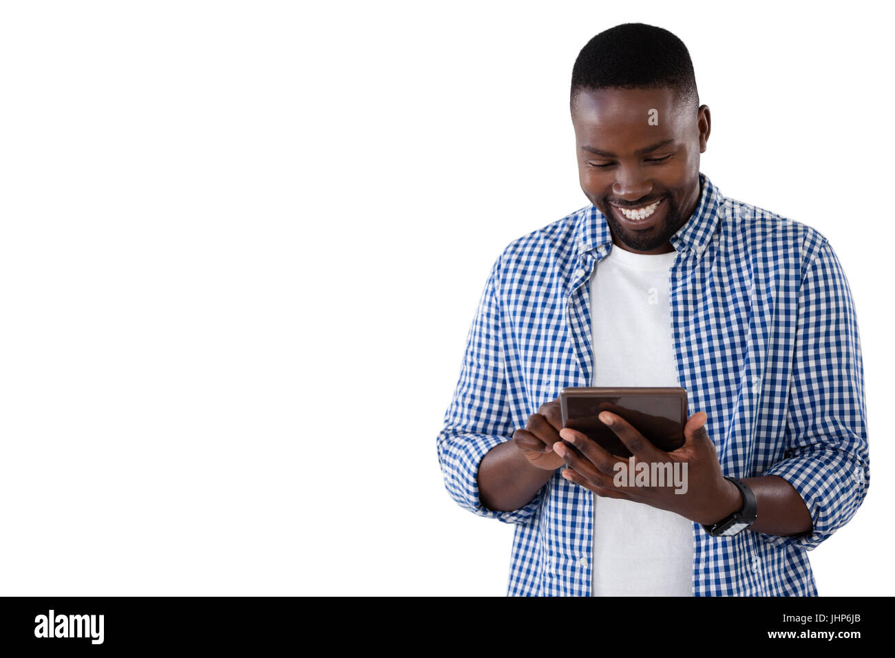 Happy man using digital tablet against white background Stock Photo - Alamy