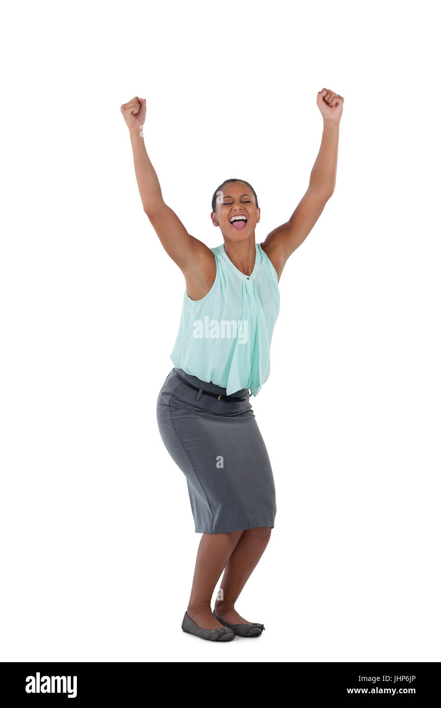 Excited businesswoman dancing against white background Stock Photo - Alamy