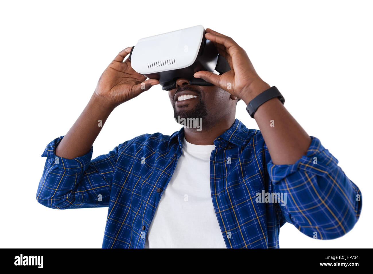 Smiling man using virtual reality headset Stock Photo - Alamy