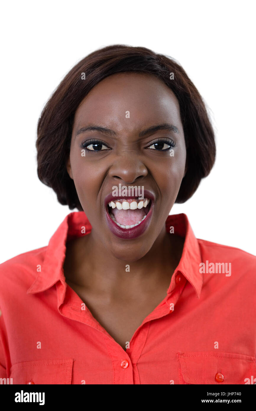 Portrait of young woman shouting against white background Stock Photo ...
