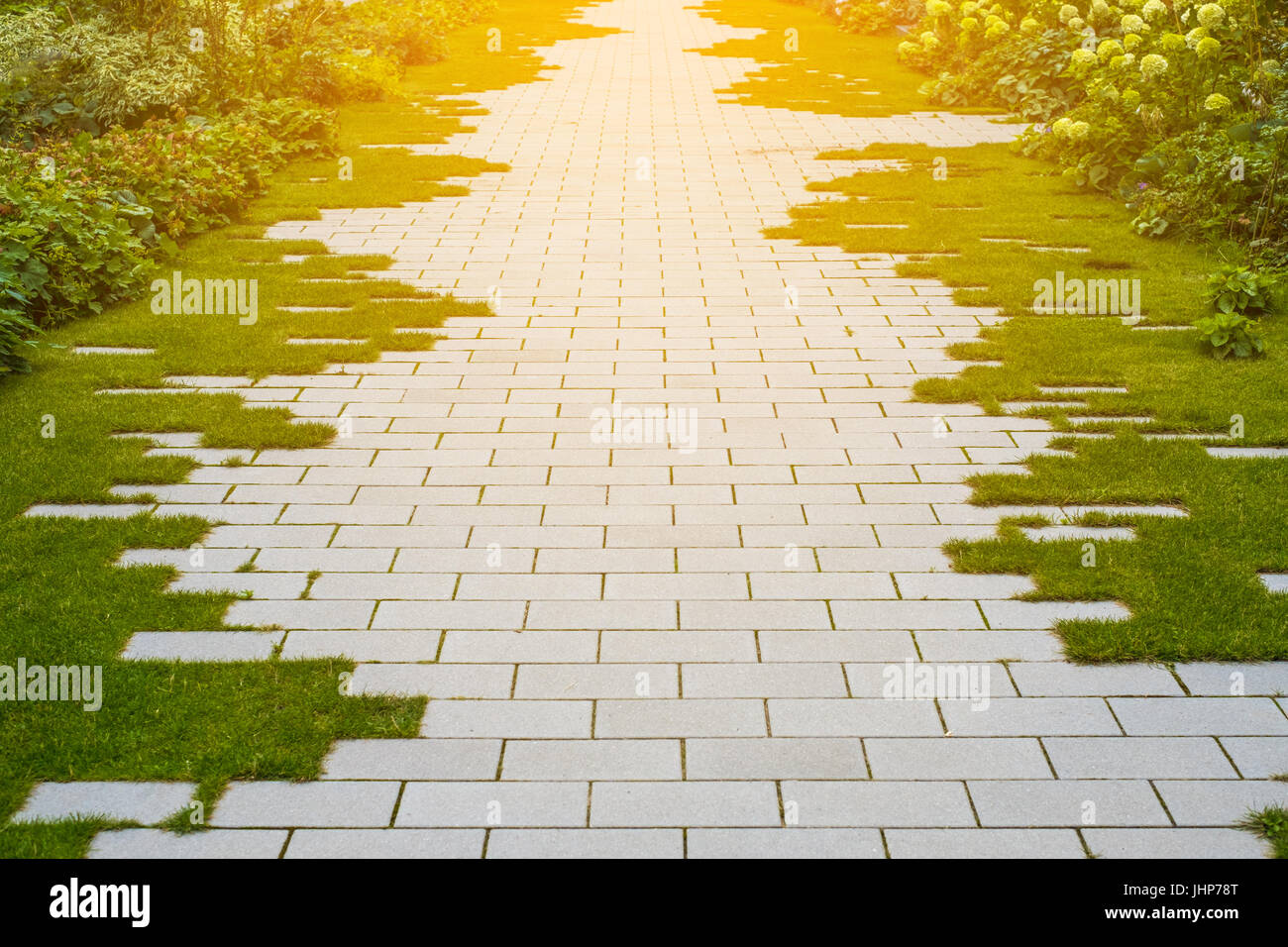 garden pavement, cobblestone and grass on sidewalk Stock Photo - Alamy
