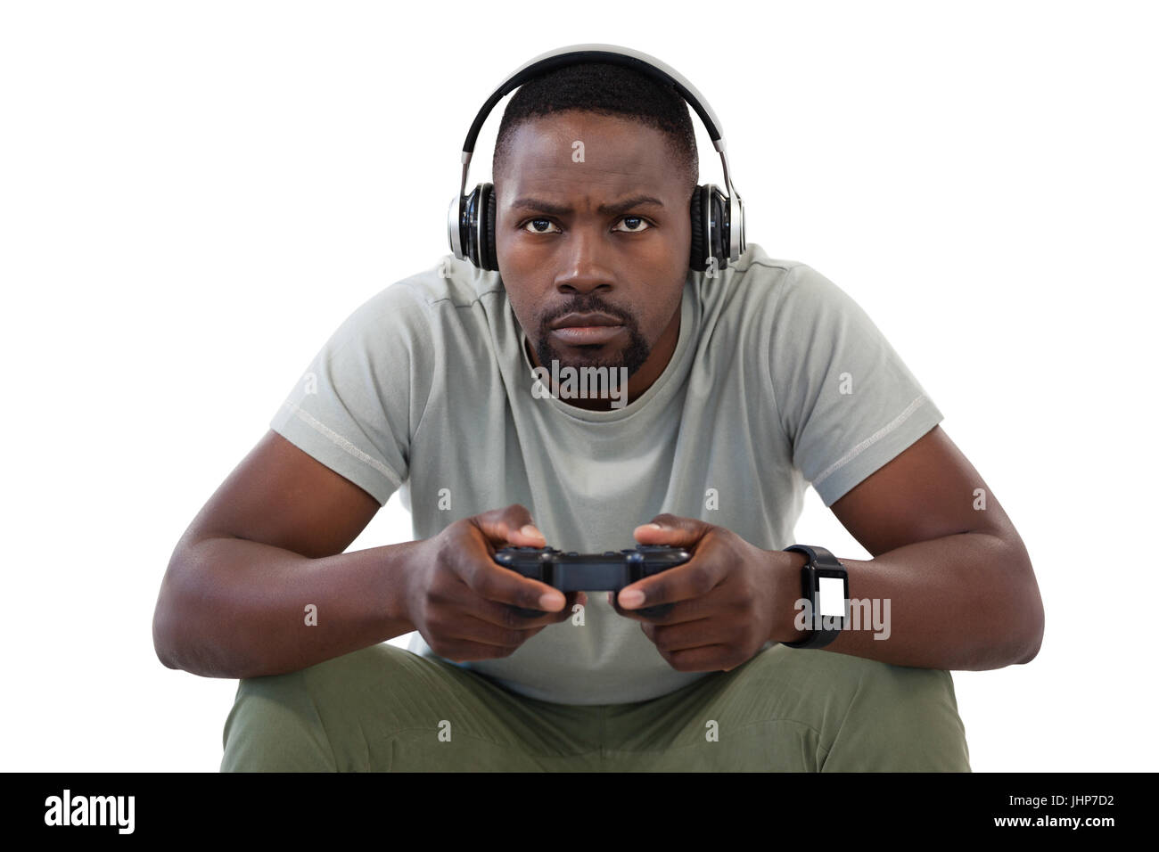 Concentrate man playing video games against white background Stock ...