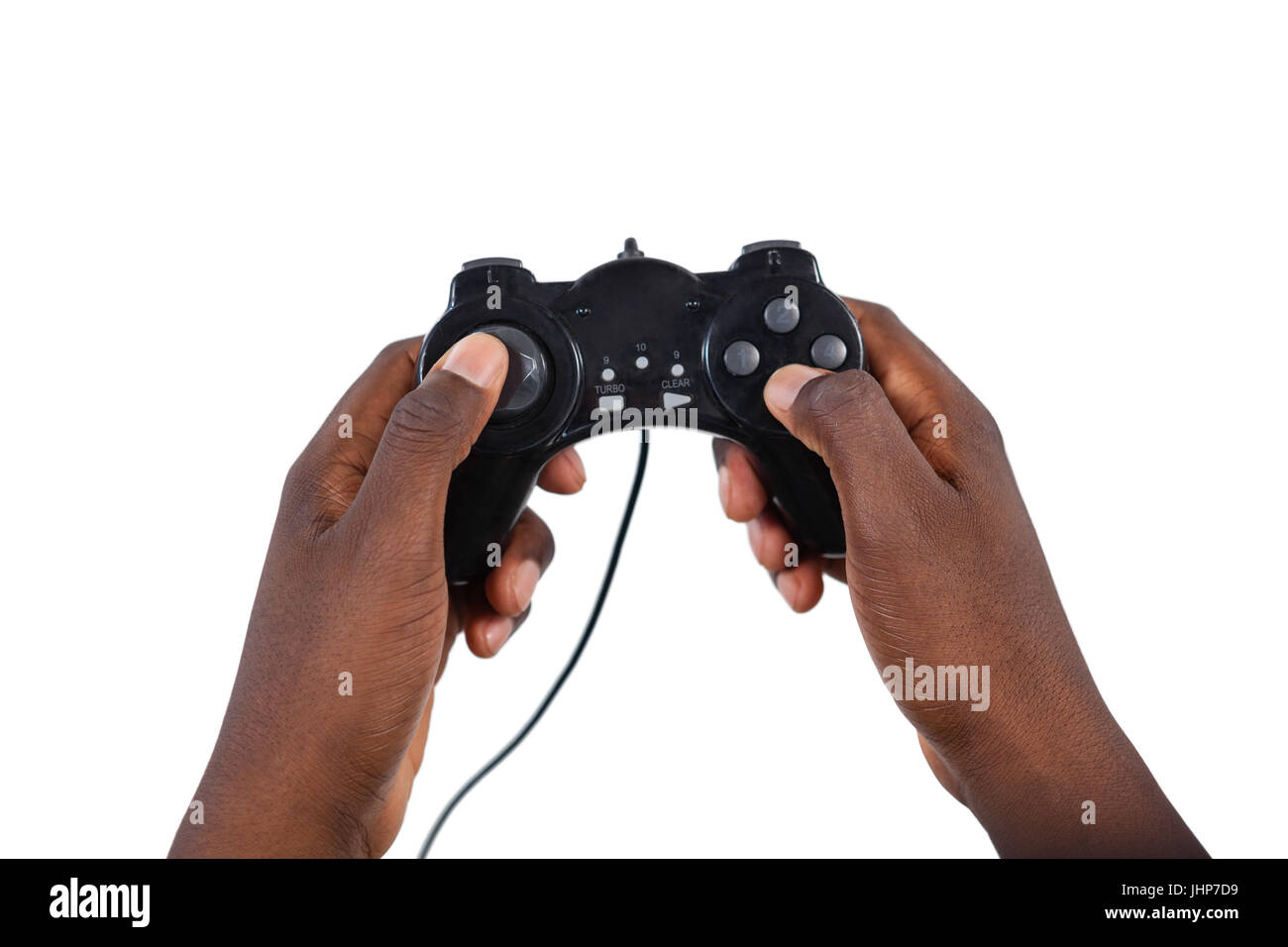 Close-up of mans hand playing video game against white background Stock ...