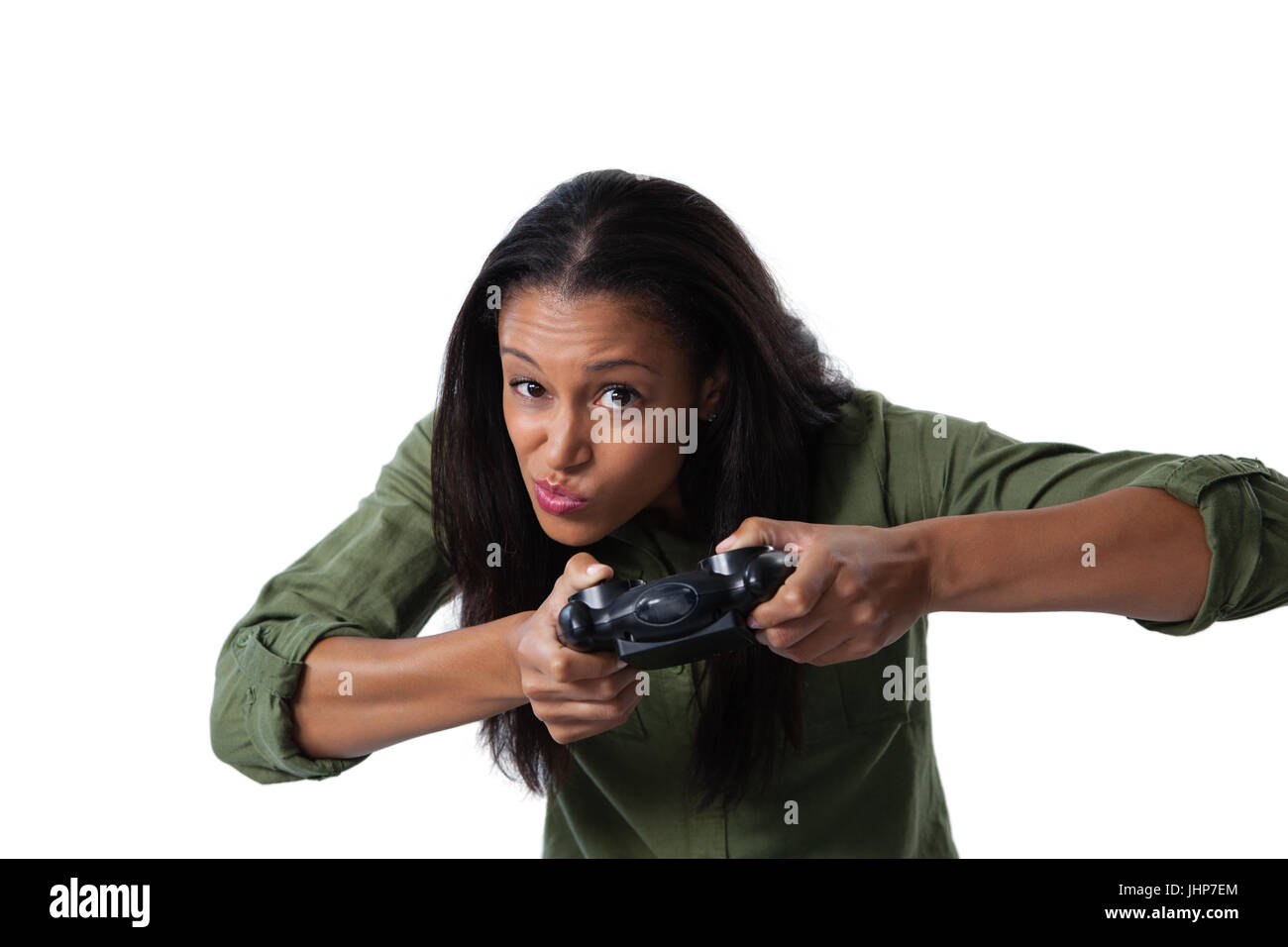Portrait of woman making funny faces while playing video games Stock ...