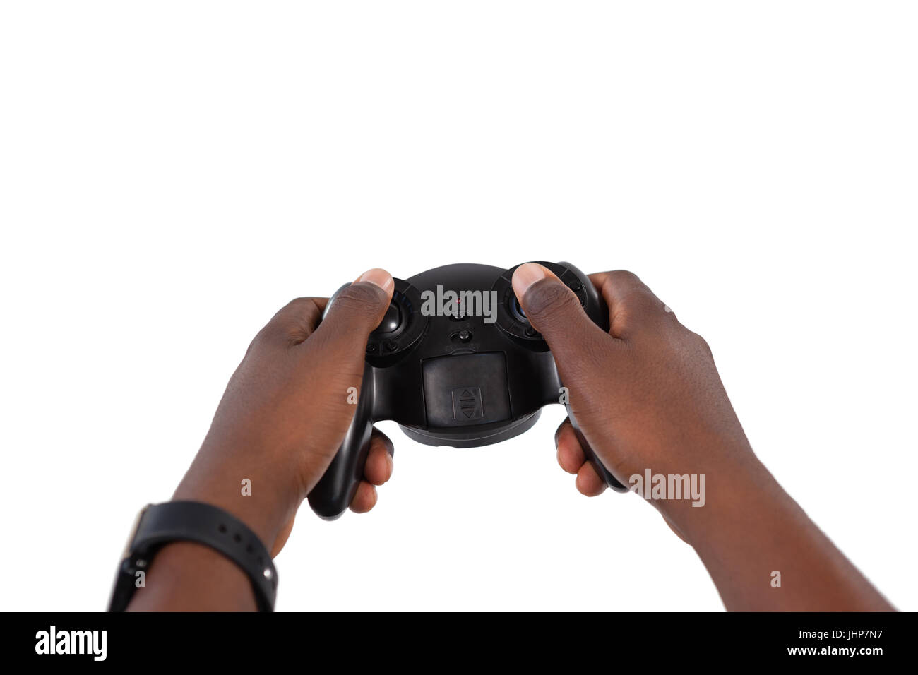 Close-up of mans hand playing video game against white background Stock ...
