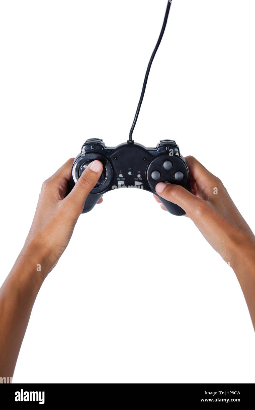 Close-up of womans hand playing video game against white background ...