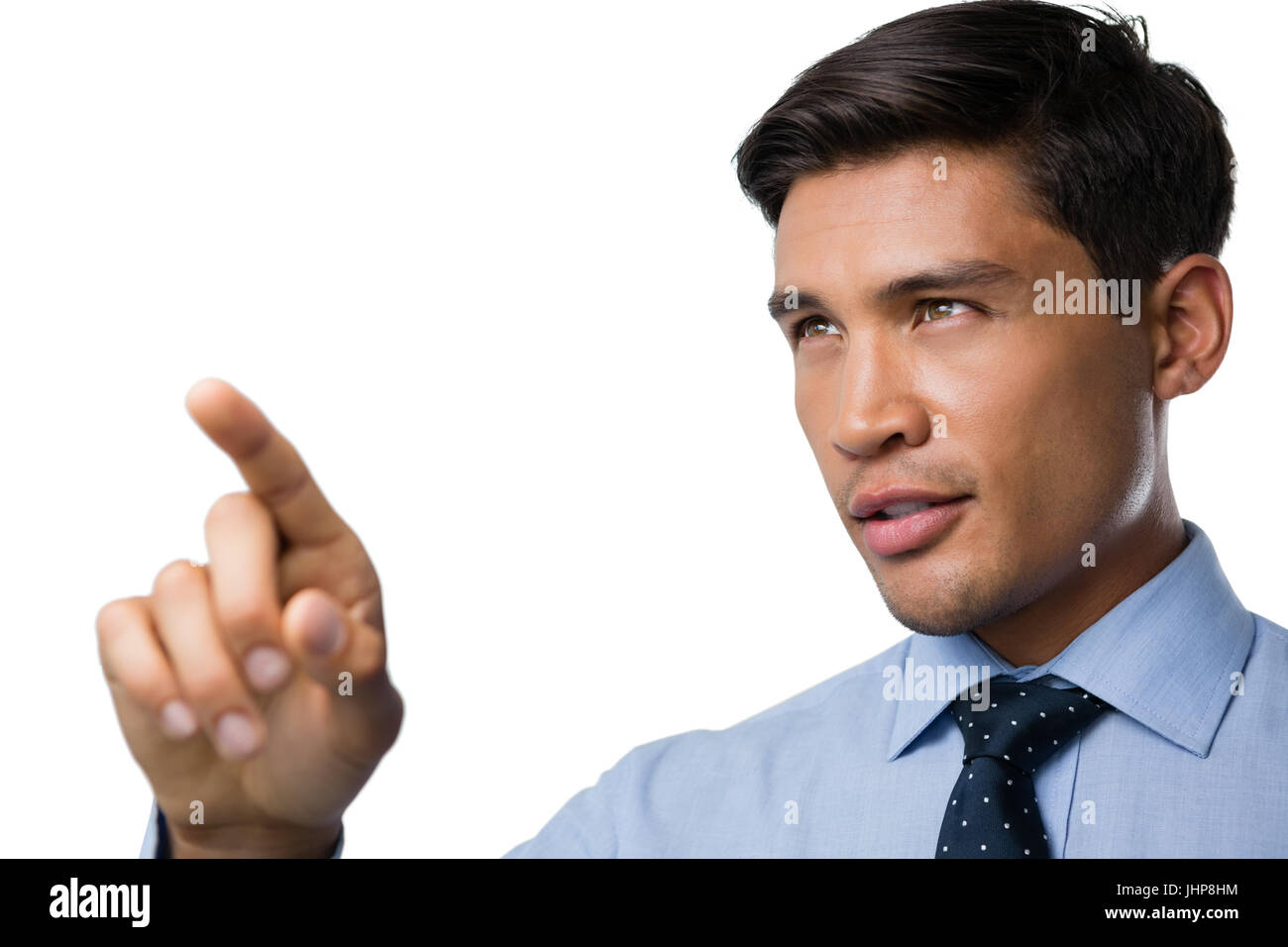 Confident businessman using invisible interface against white ...