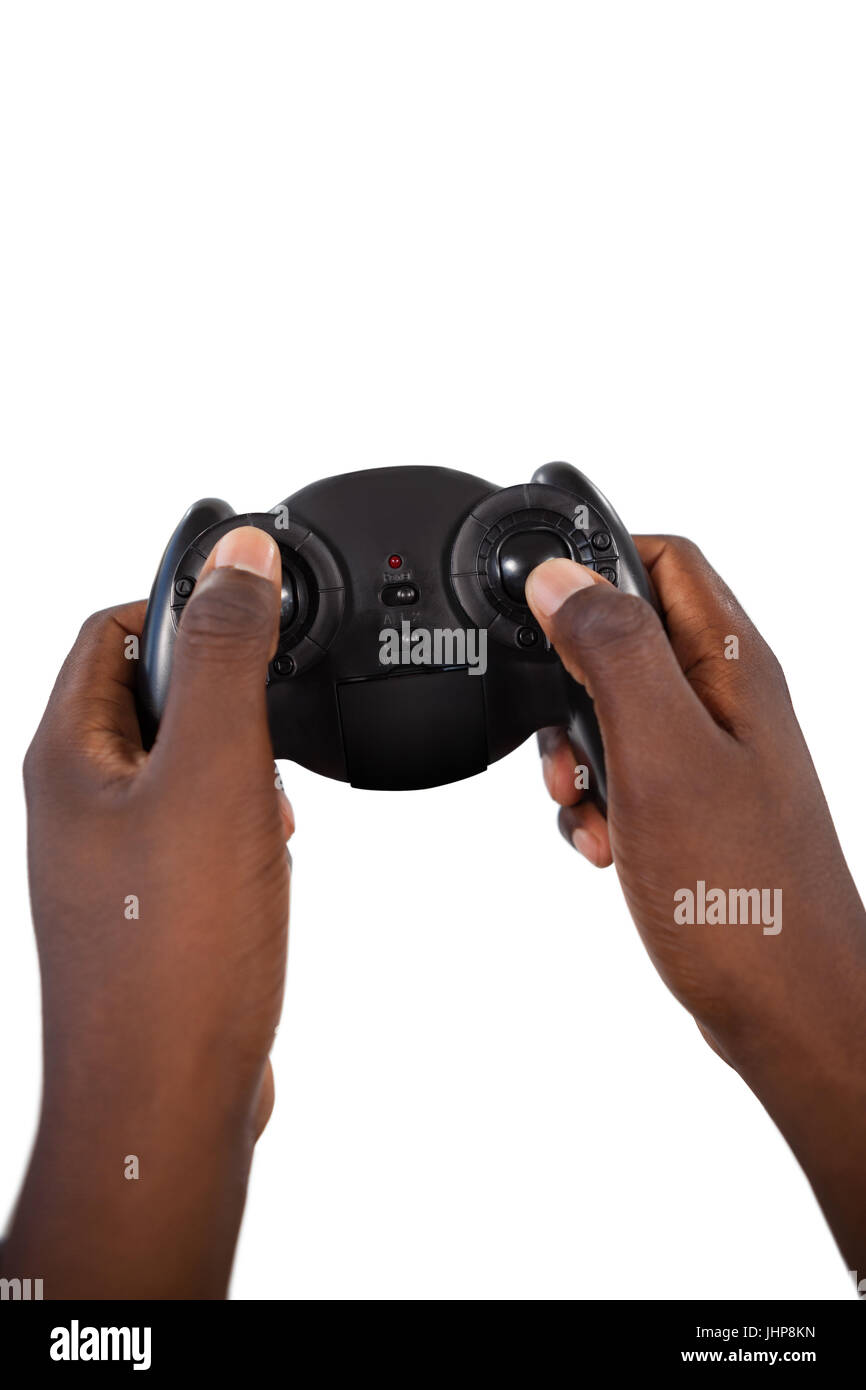 Close-up of mans hand playing video game against white background Stock ...