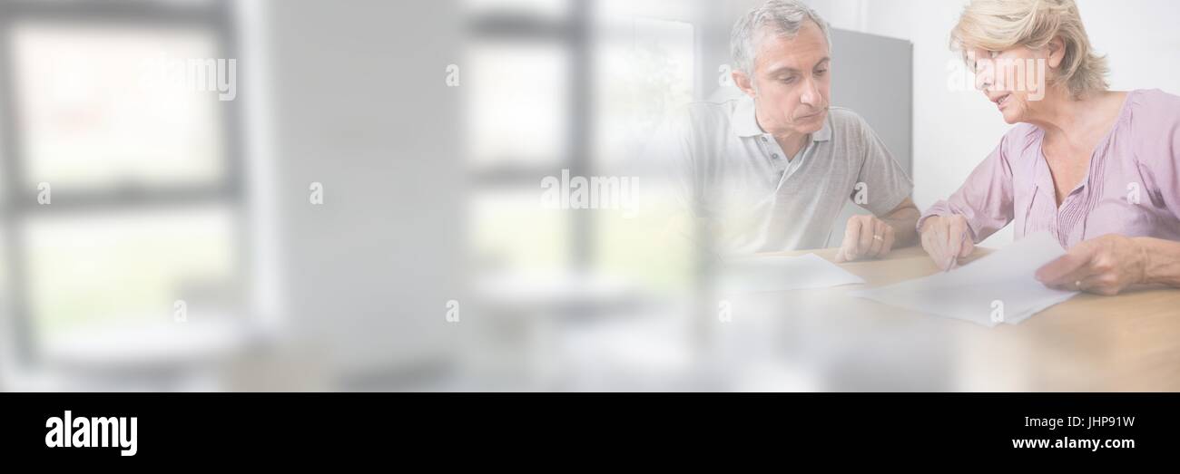 Older woman reading documents hi-res stock photography and images - Alamy