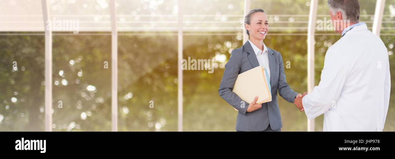 Digital composite of Woman holding files and folders handshake with ...