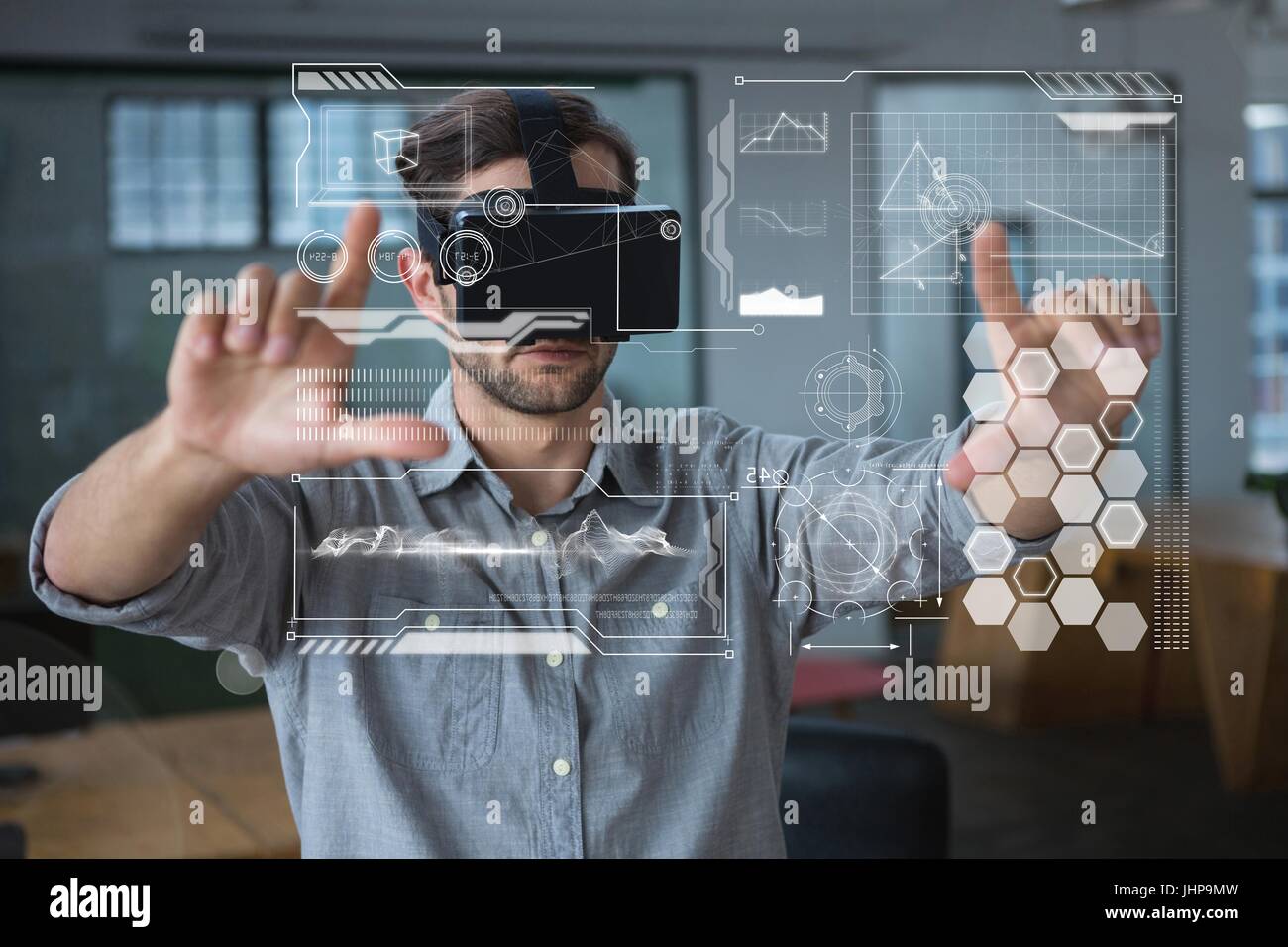 Digital composite of Man in VR headset touching interfaces Stock Photo ...