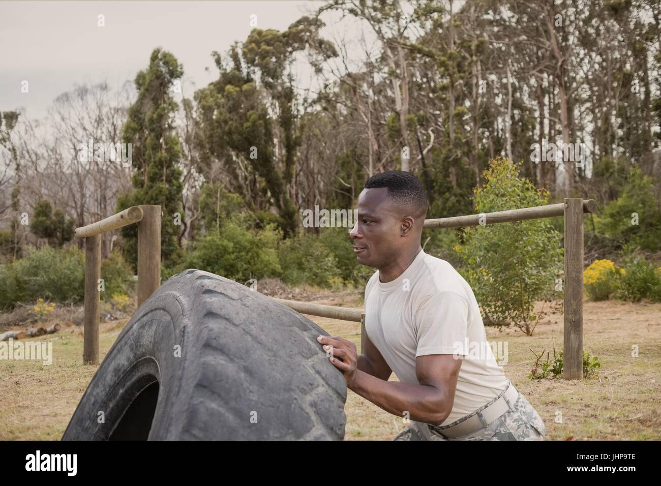 Digital composite of Soldier man pushing a wheel Stock Photo - Alamy