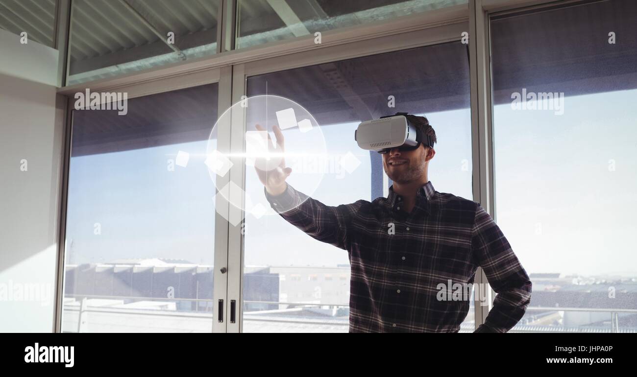 Digital composite of Man in VR headset touching interface Stock Photo ...