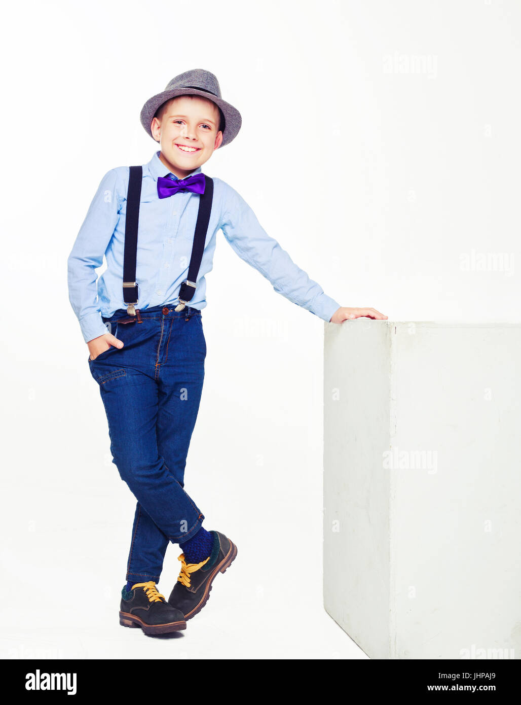 happy stylish boy wearing a hat, isolated Stock Photo - Alamy