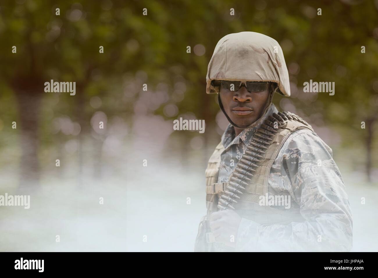 Digital composite of Soldier man standing against green background with ...