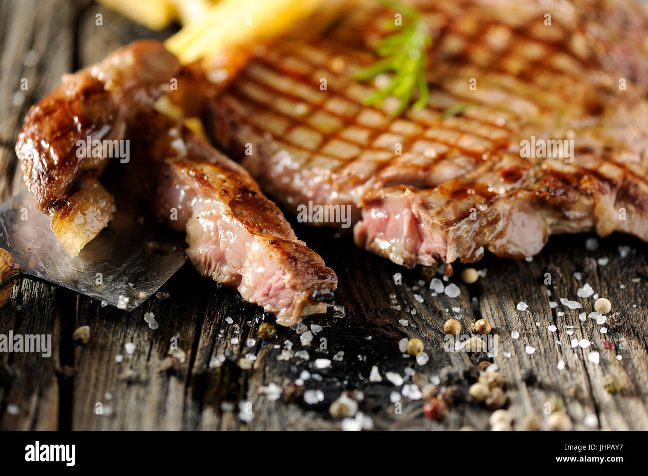 Beef Steak on wooden table Stock Photo - Alamy