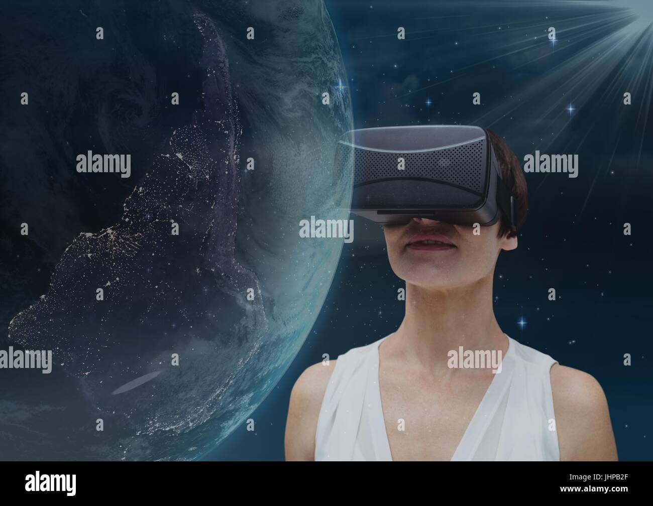 Digital composite of Woman in VR headset looking at 3D planet against ...