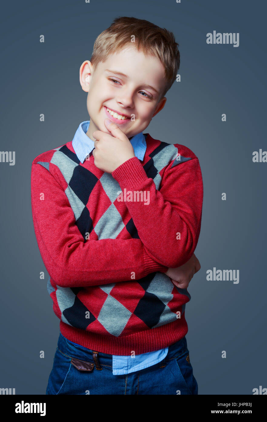happy thoughtful boy isolated against grey background Stock Photo - Alamy