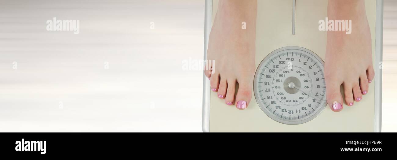 Digital composite of Feet on weighing scales Stock Photo - Alamy