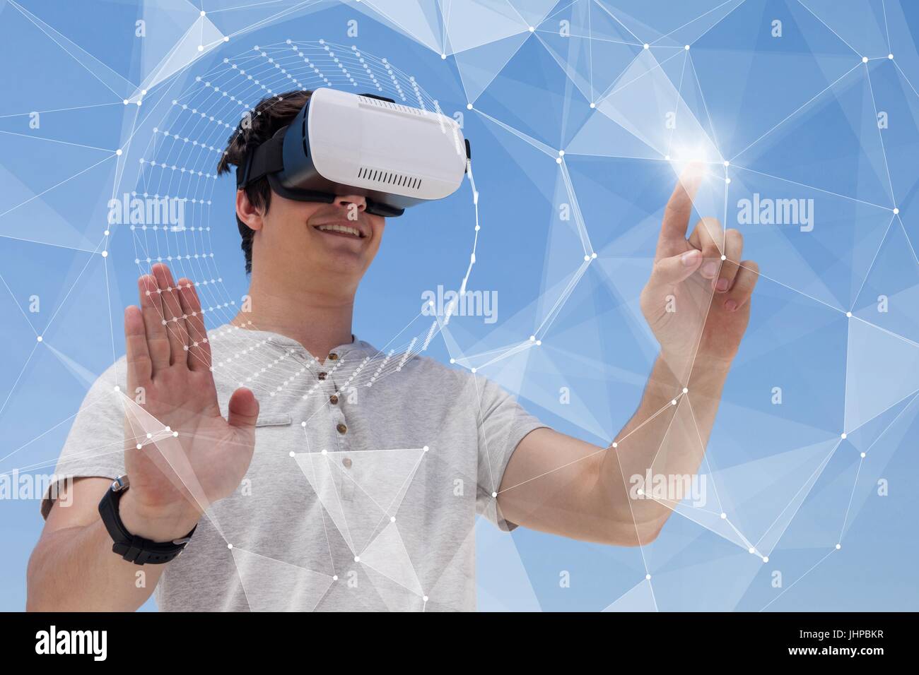Digital composite of Happy man in VR headset touching interface against ...