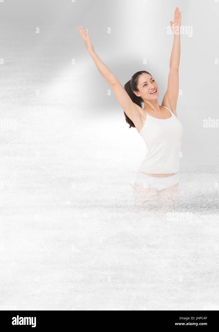 Digital composite of Slim healthy woman stretching arms Stock Photo - Alamy