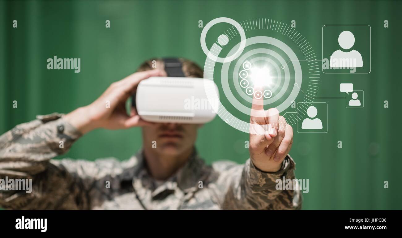 Digital composite of Man in VR headset touching interface with flare ...