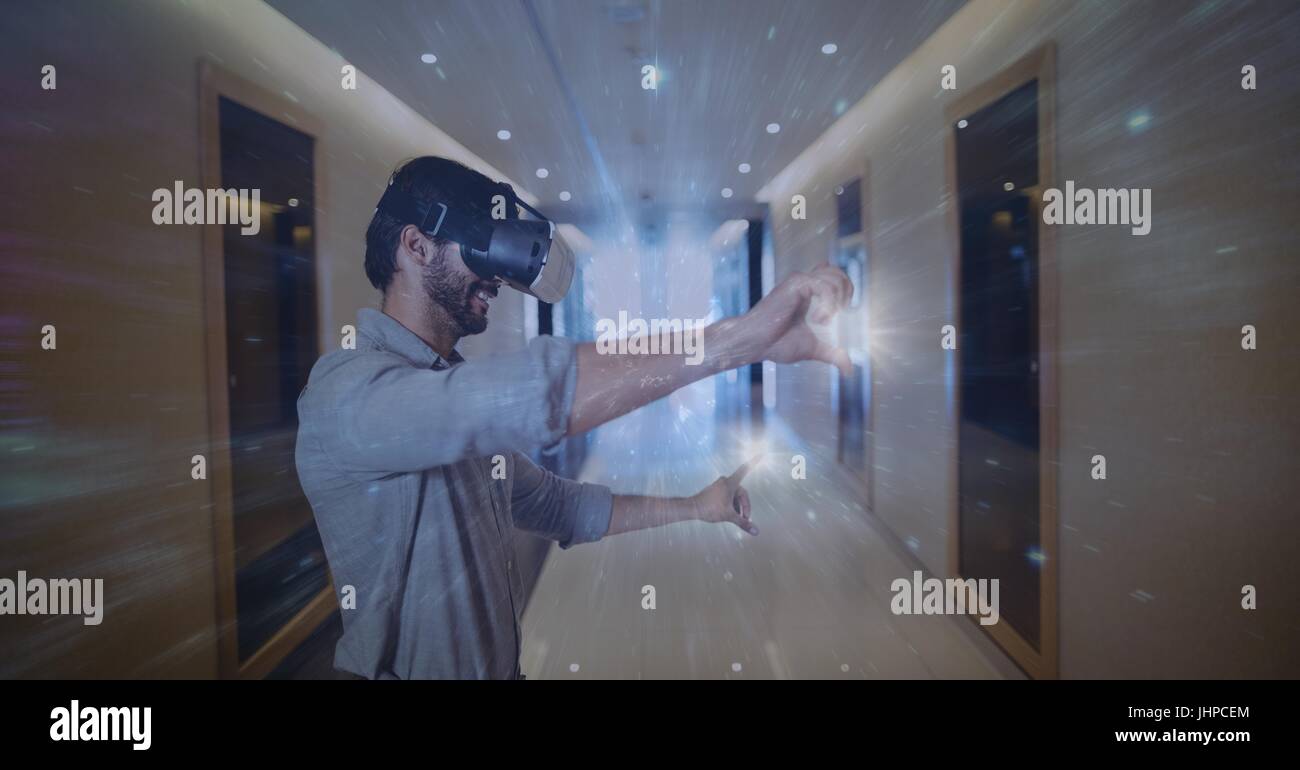 Digital composite of Man in VR headset touching flares Stock Photo - Alamy