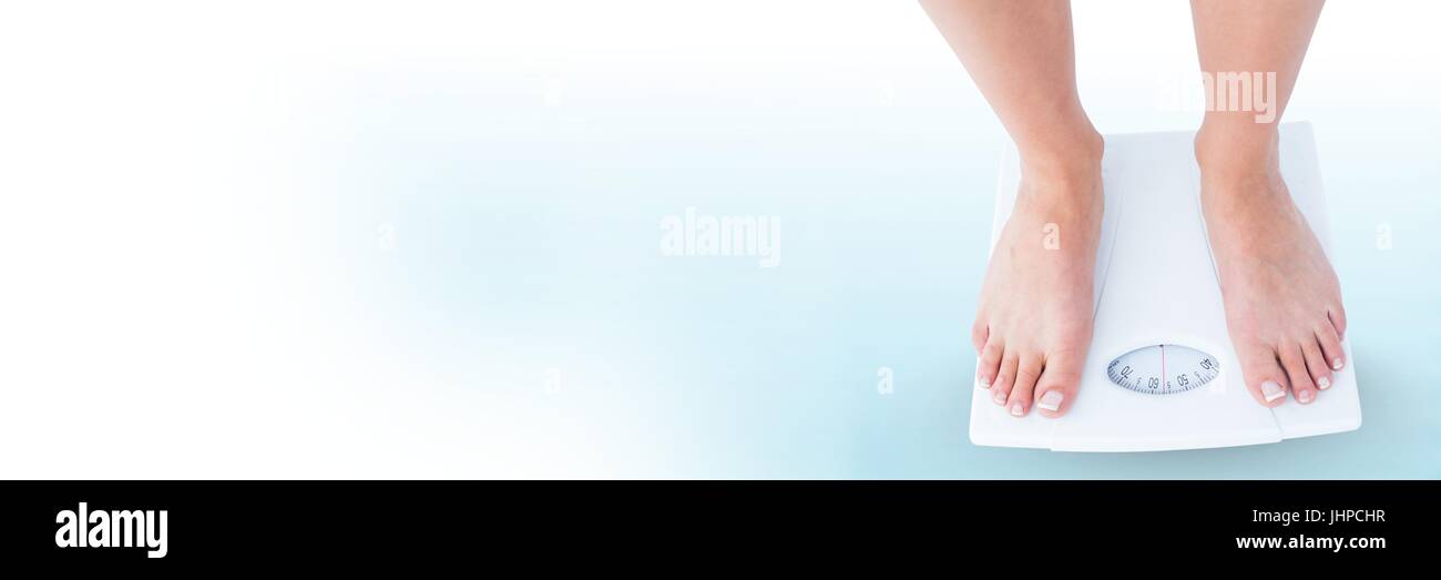 Digital composite of Feet on weighing scales Stock Photo - Alamy