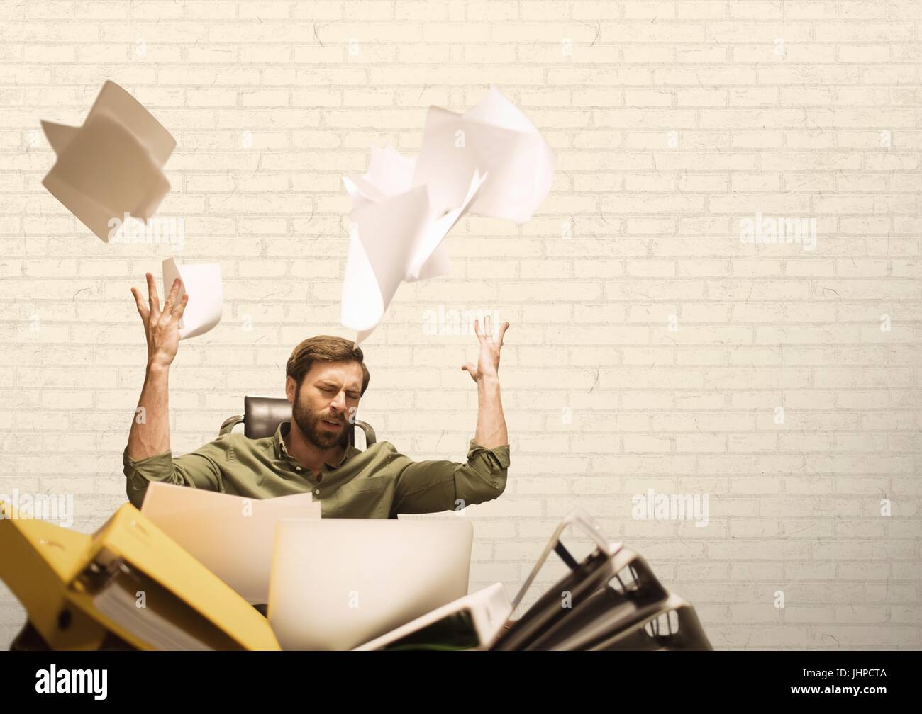 Digital composite of Frustrated business man throwing paper against ...