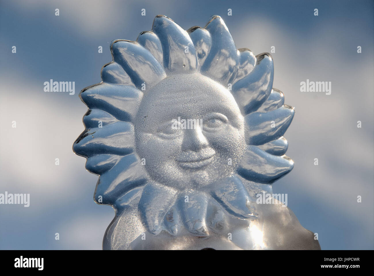 Translucent glass face of sun god sculpture hi-res stock photography ...