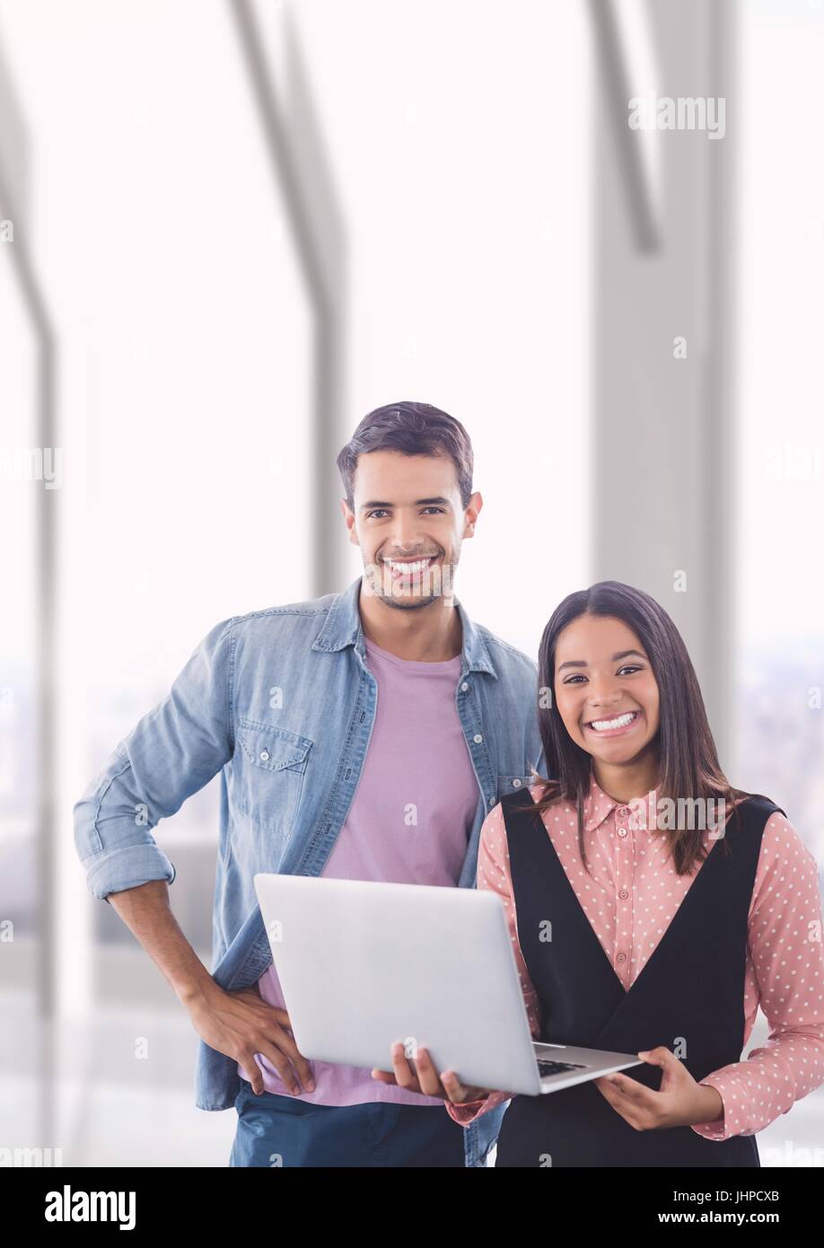 Digital composite of Happy business people holding a computer Stock ...