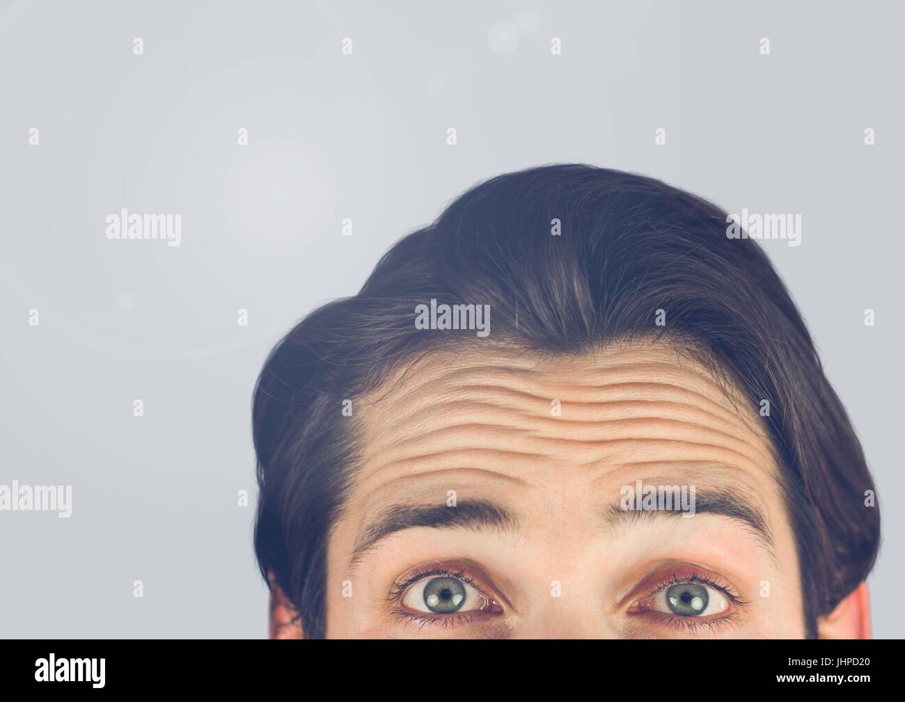 Digital composite of Portrait of Mans top of head with grey background ...