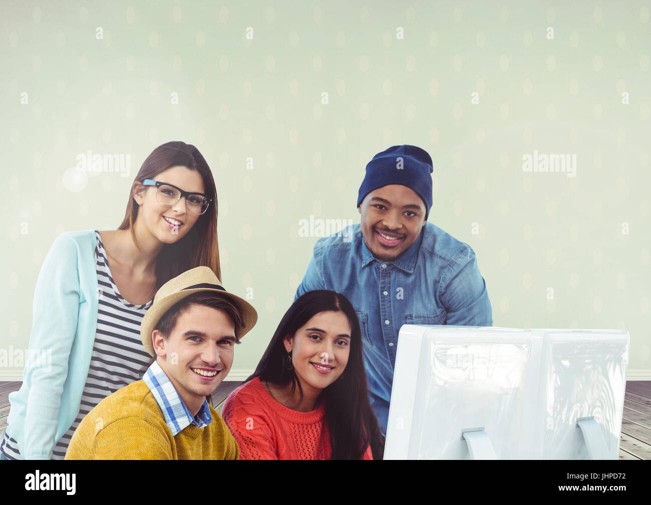 Digital composite of Group of people on laptop in front of bright ...