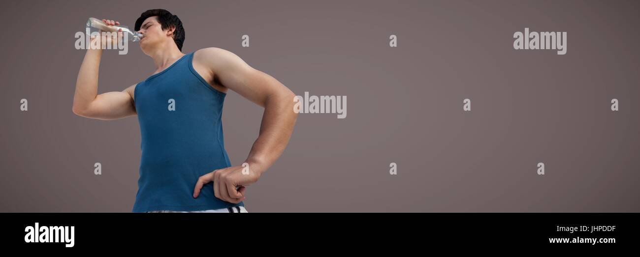 Digital composite of Low angle of man in training gear drinking water ...