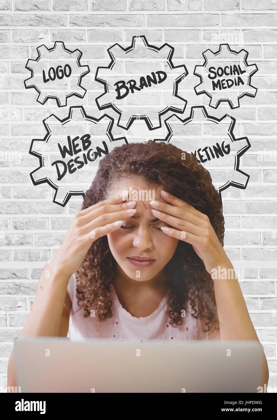 Digital composite of Frustrated business woman at a desk using a ...