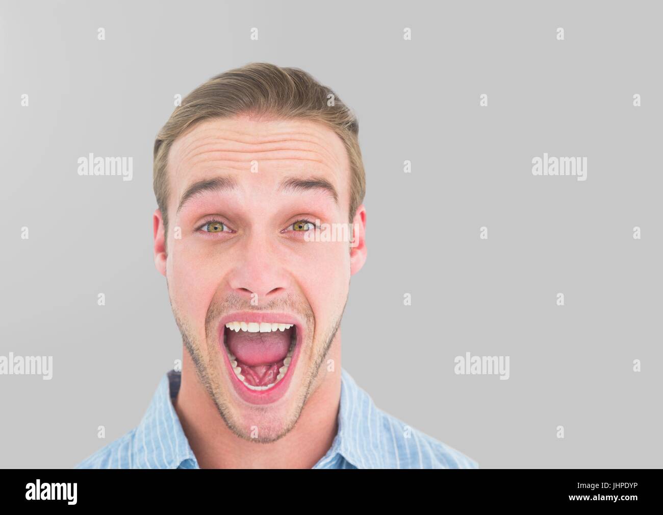 Digital composite of Portrait of cheering Man with grey background ...