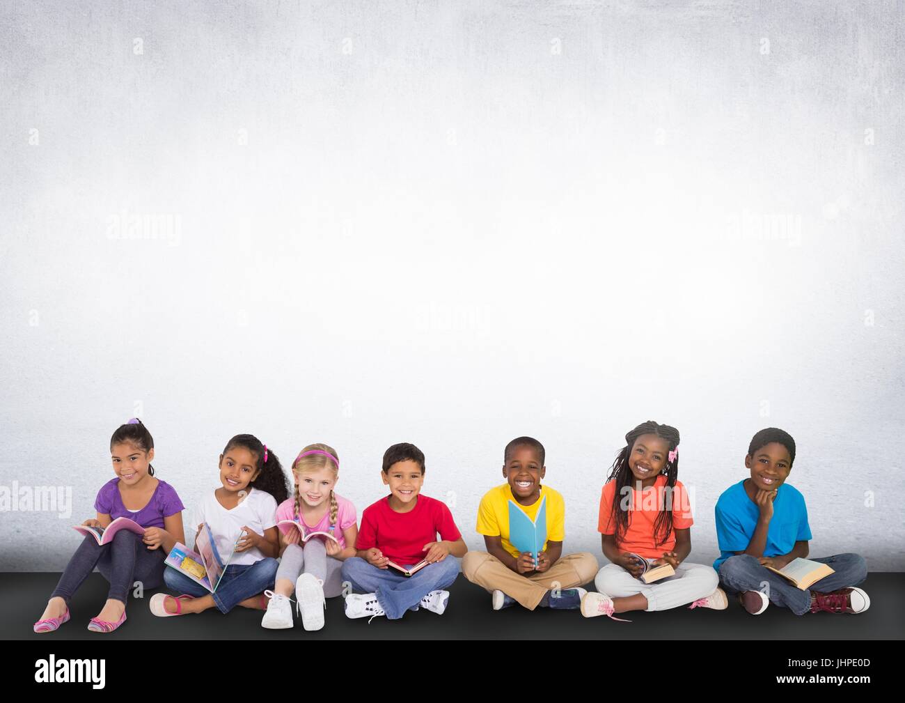Digital composite of Group of children sitting in front of blank grey ...