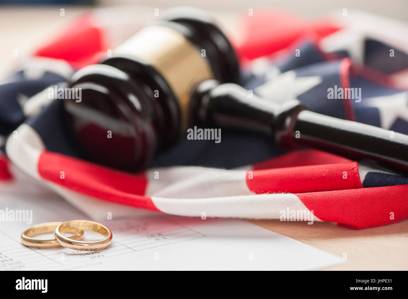 wedding rings and gavel Stock Photo - Alamy