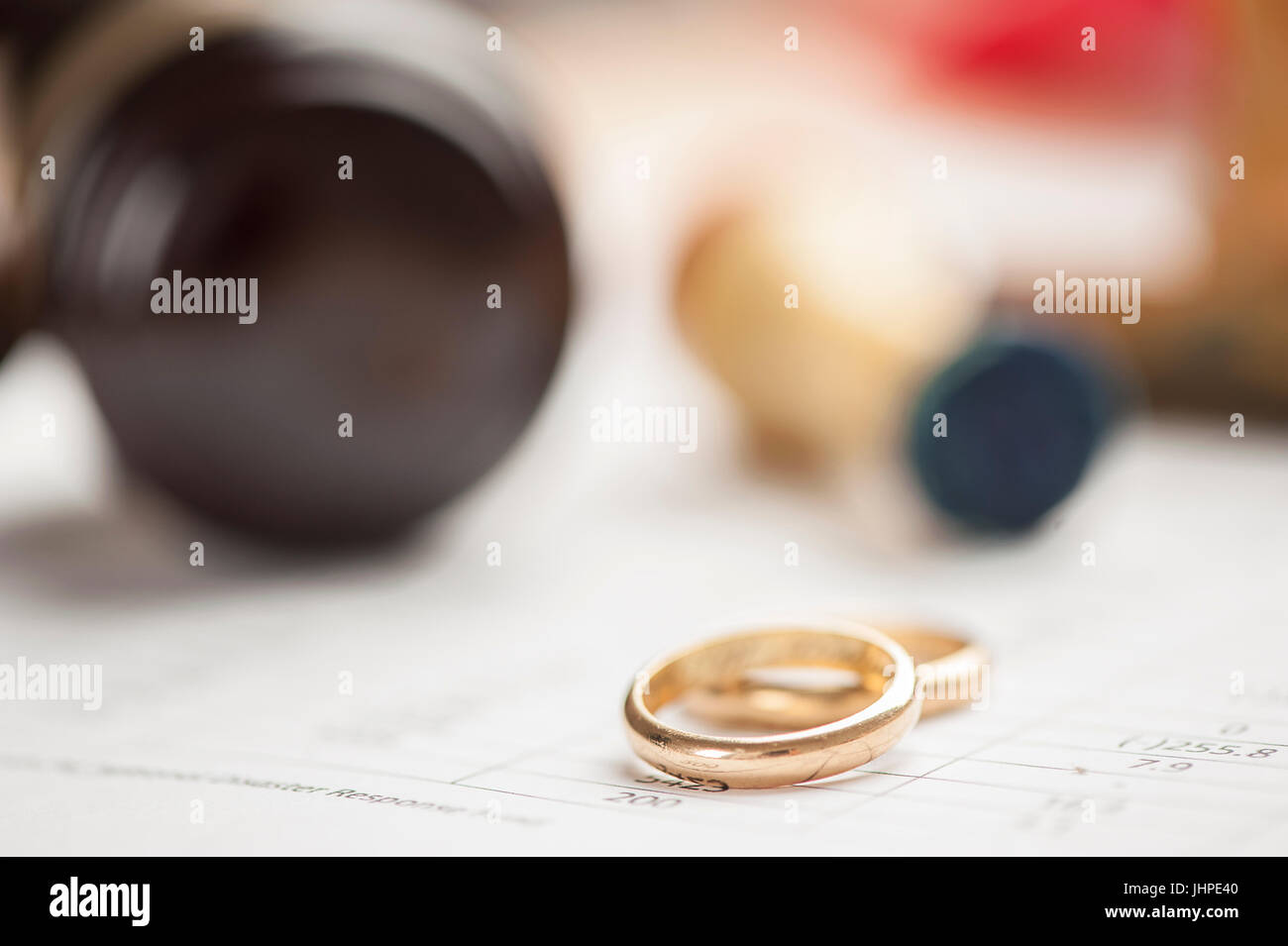 wedding rings and gavel Stock Photo - Alamy