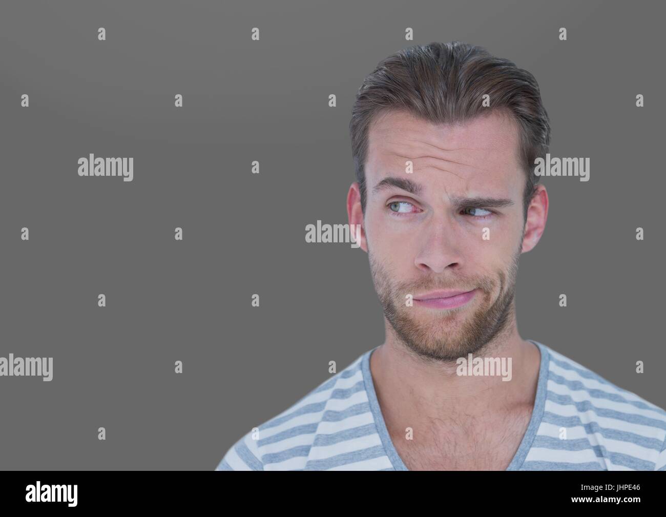 Digital composite of Portrait of curious Man with grey background Stock ...