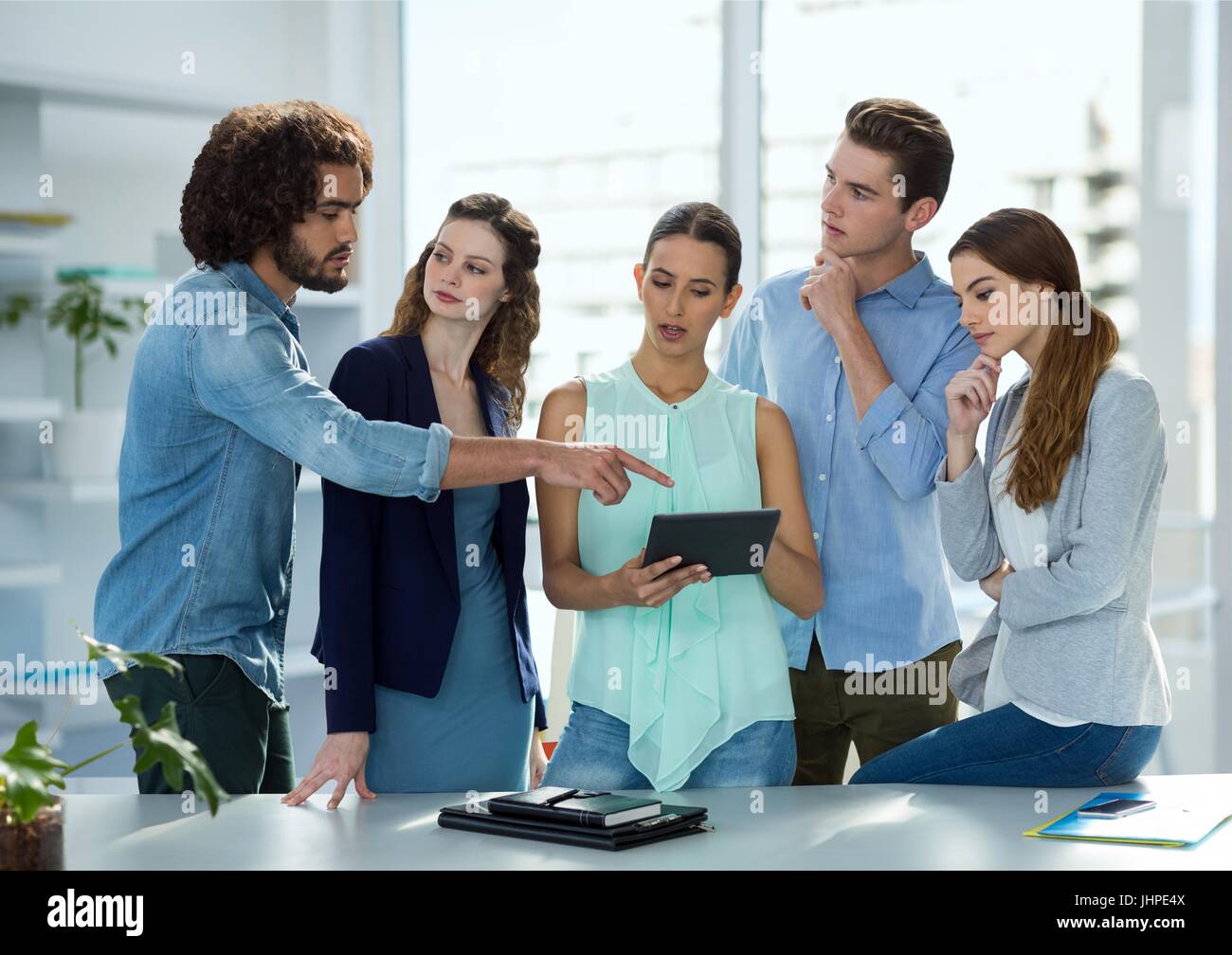 Digital composite of Business people at a desk talking Stock Photo - Alamy