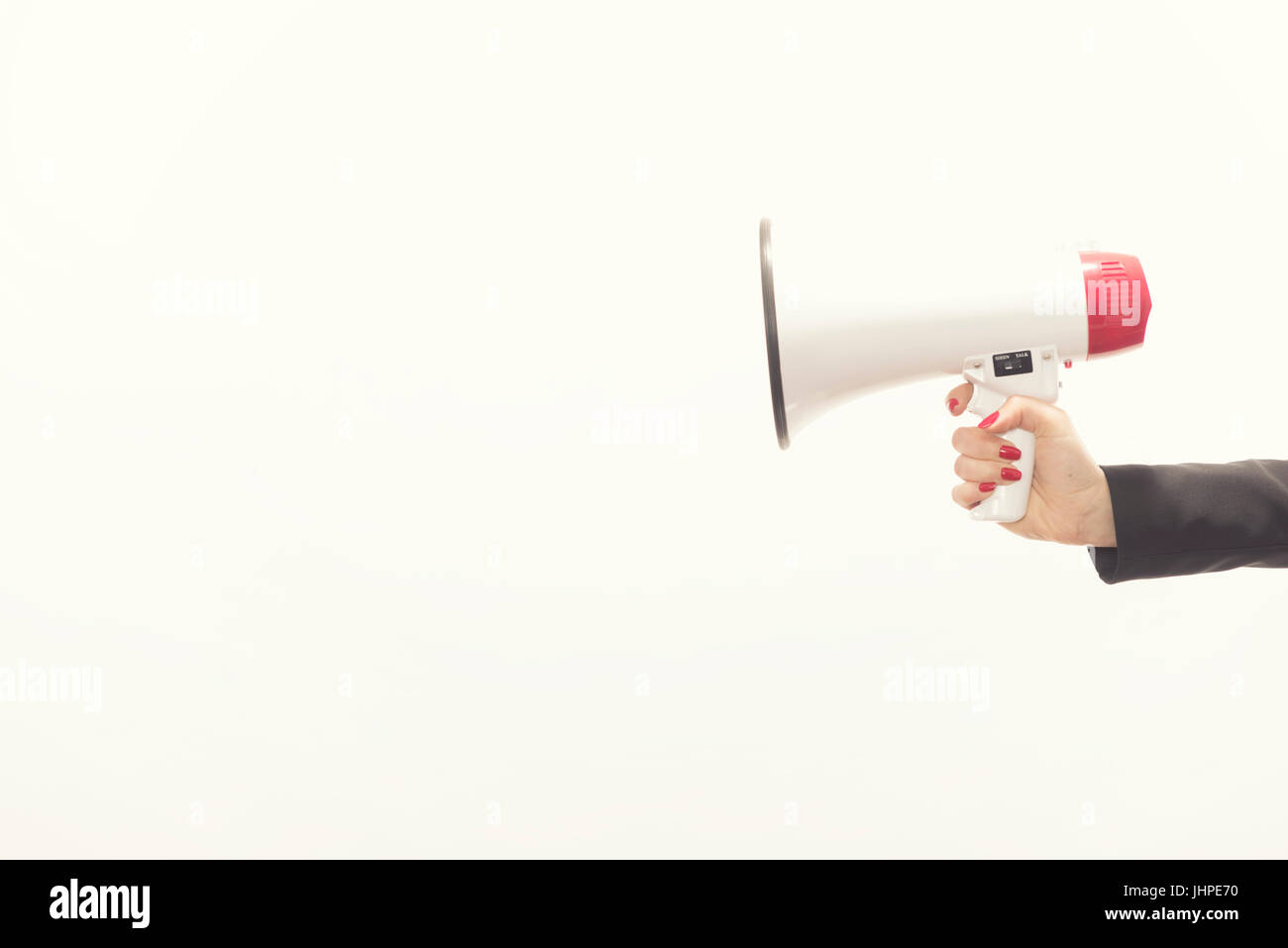 businessman's hand holding a megaphone isolated on white background ...