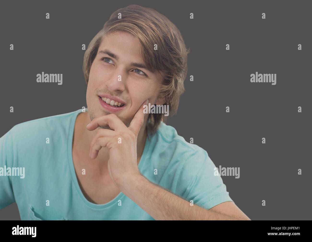 Digital composite of Portrait of Man thinking with grey background ...