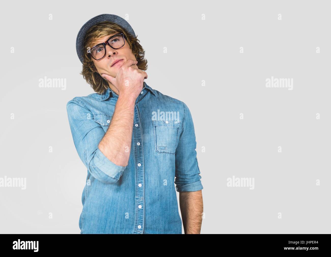 Digital composite of Portrait of Man thinking with grey background ...