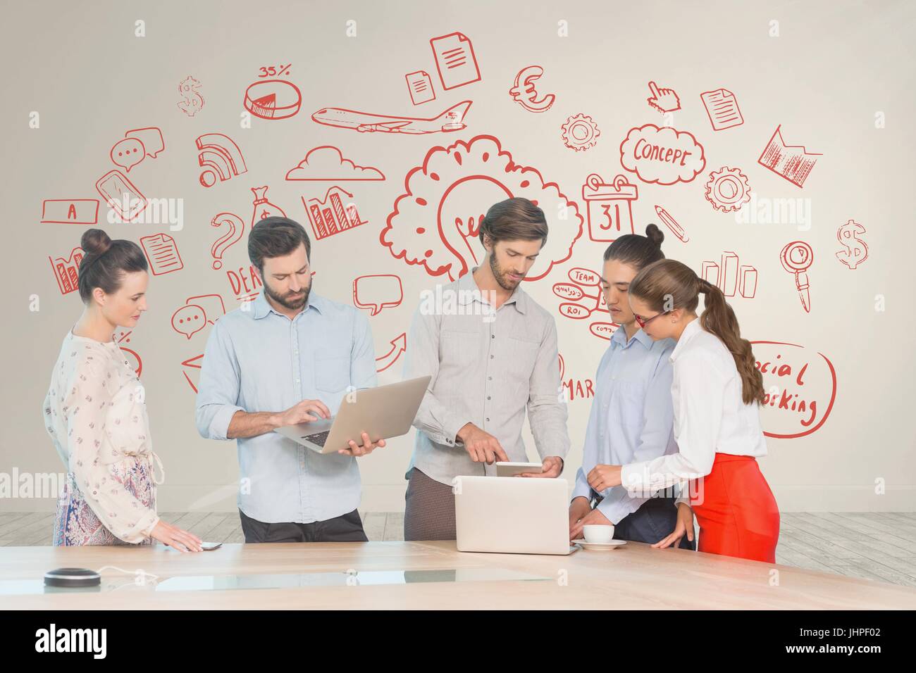 Digital composite of Business people at a desk looking at computers and ...