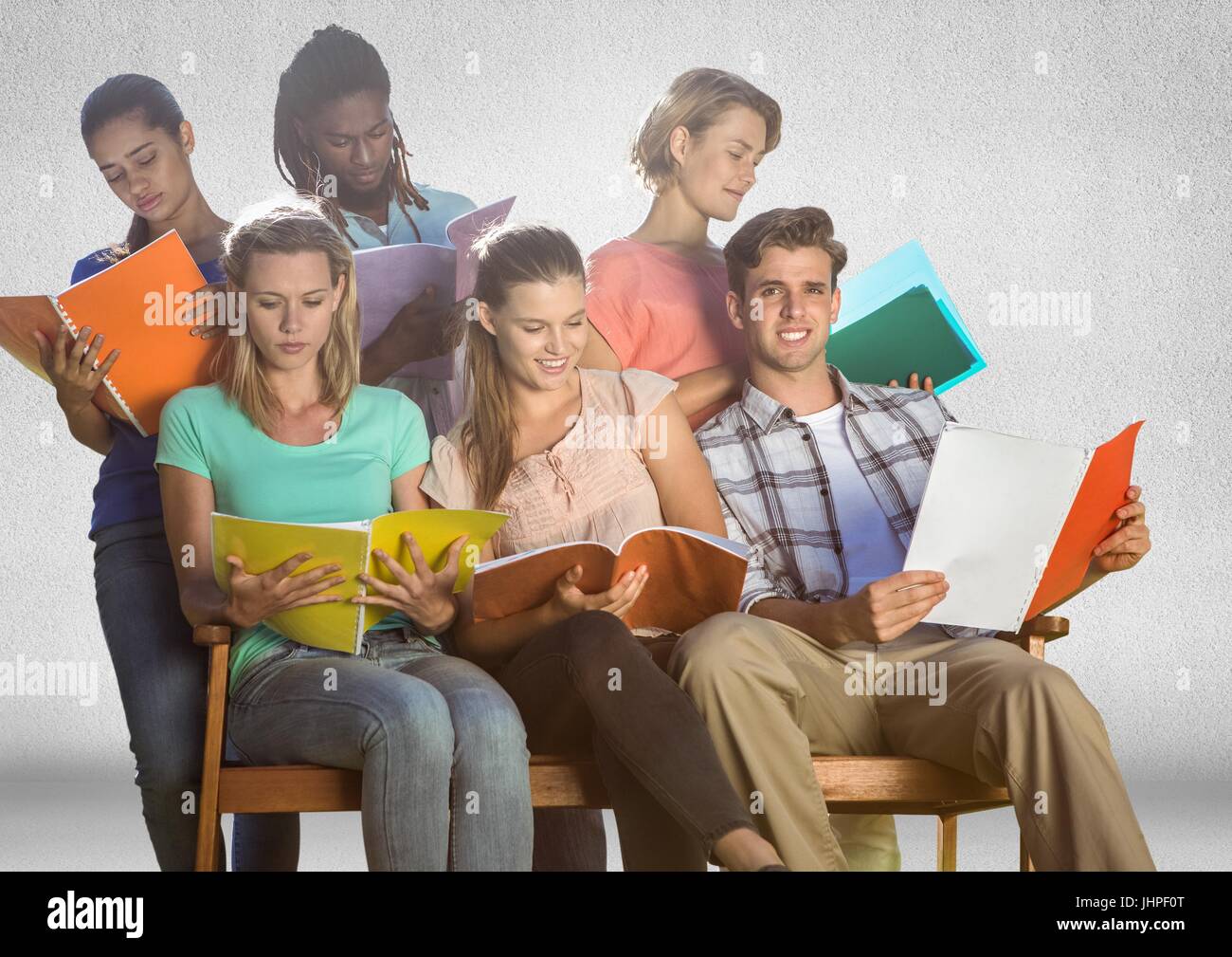 Digital composite of Group of students studying sitting in front of ...