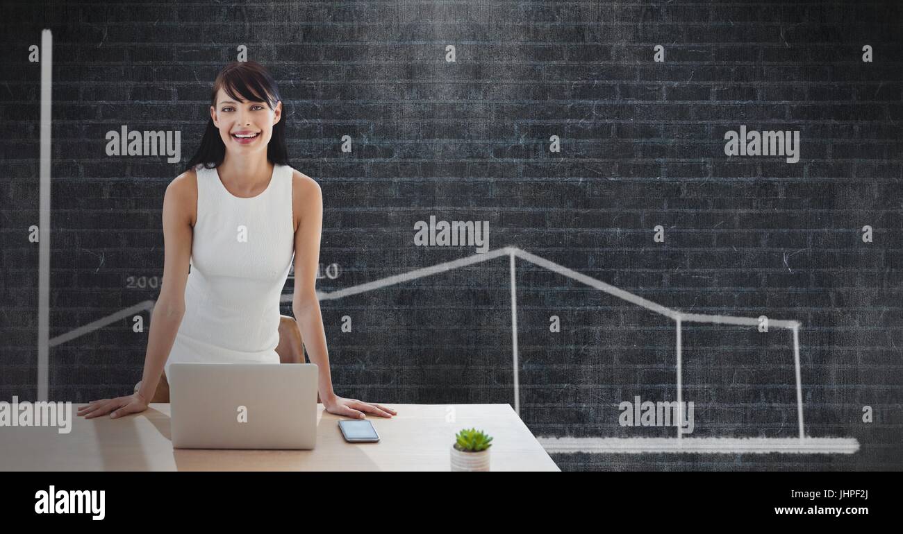 Digital composite of Happy business woman at a desk using a computer ...