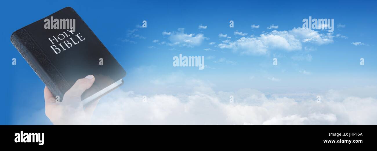 Digital composite of Hand holding bible and sky transition Stock Photo ...